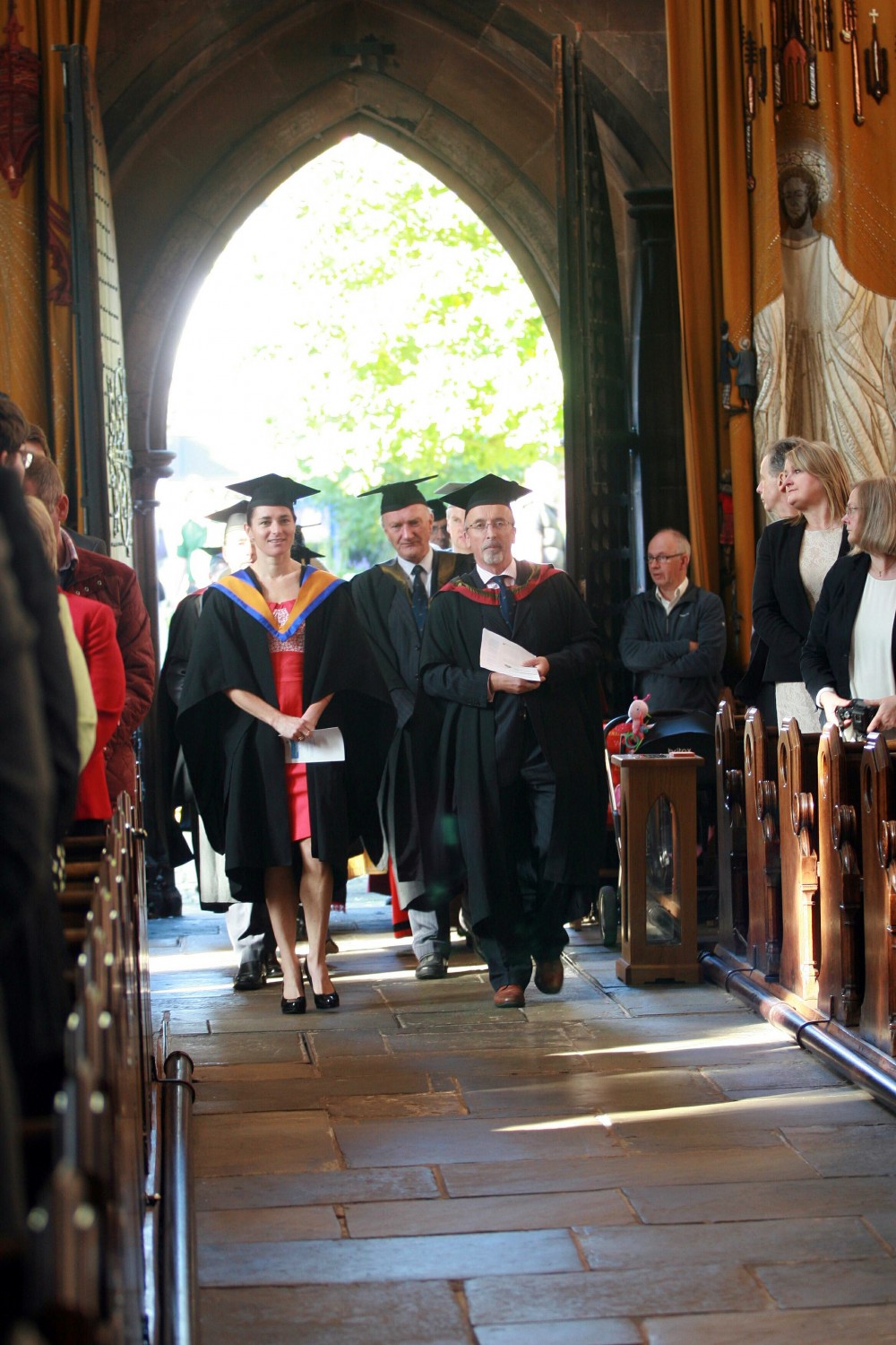 Dame Sarah Storey and Principal Meredydd David leads the procession party - Reaseheath College