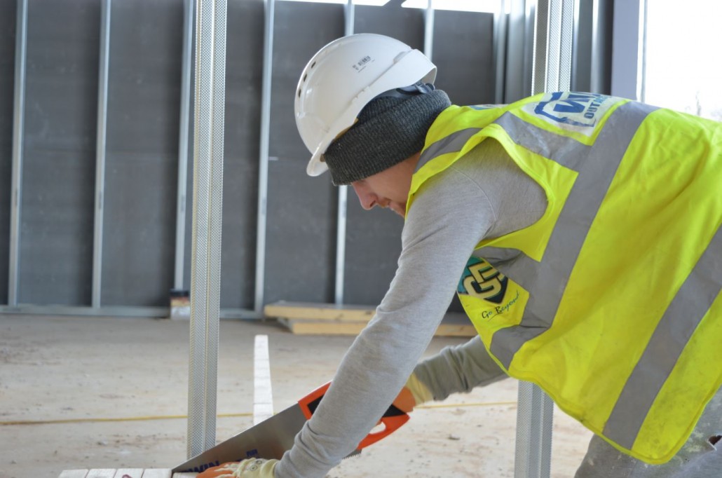 Construction - student cutting studword - Reaseheath College
