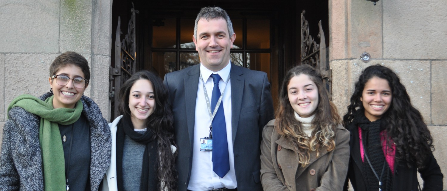 Nagela Ruphael Alessandra Bina Sarah Amorim and Julia Silva with Assistant Dean Mark Harris crop ...
