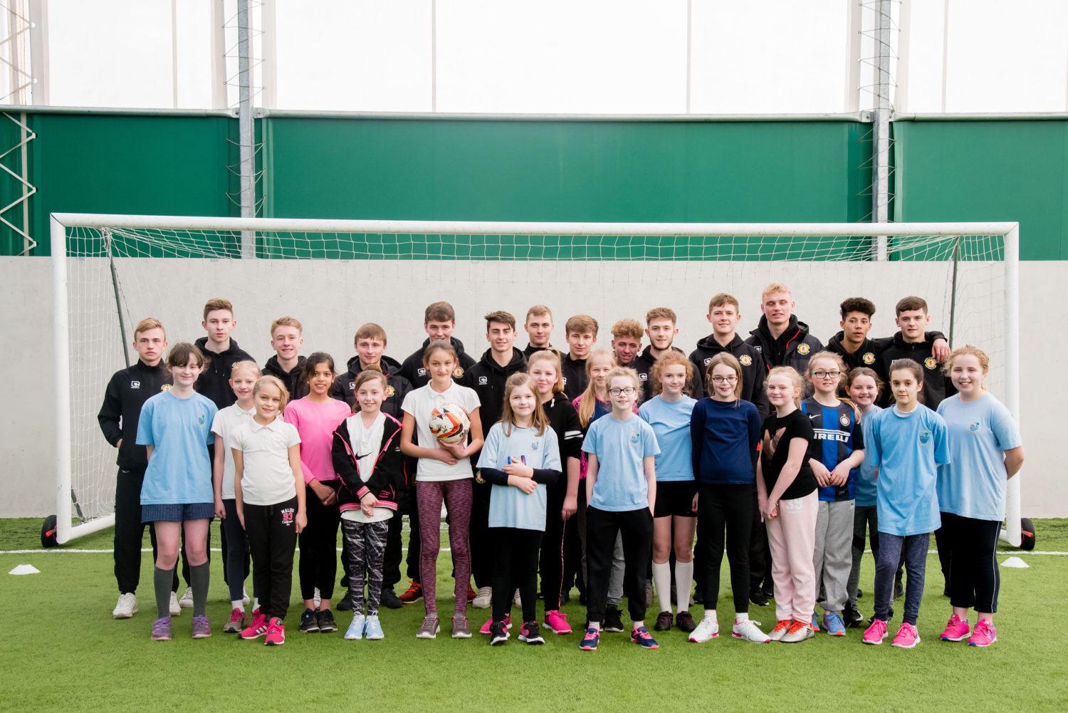 Millfields Primary School pupils with Crewe Alex apprentices - Reaseheath College