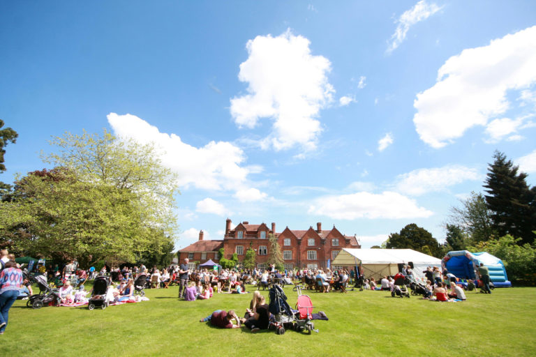 Crowds enjoy the sunshine on the lawn - Reaseheath College