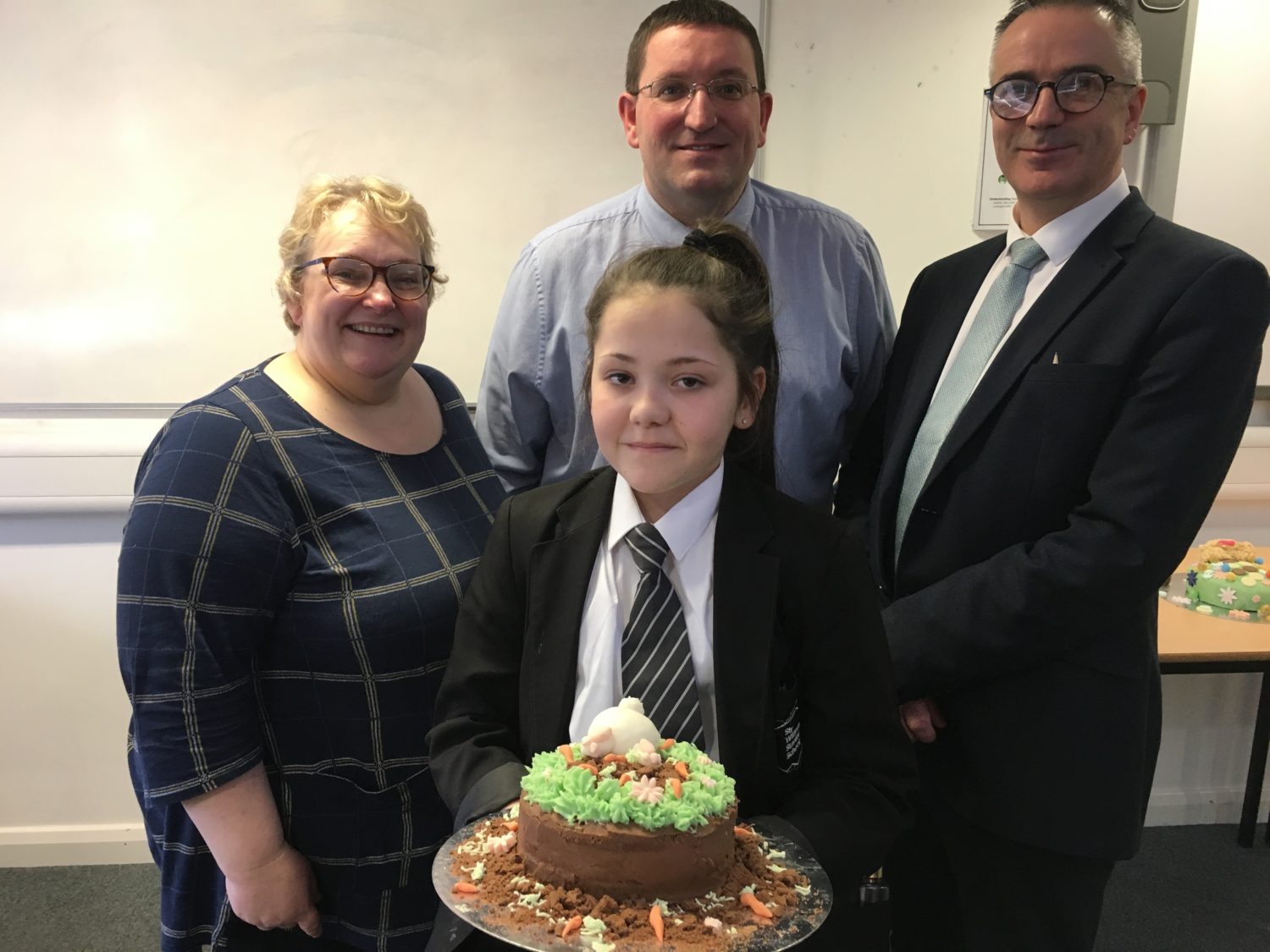 Krystal shows off her cake with Sam Copeland, Nick Blakemore and Sir William Stanier School ...