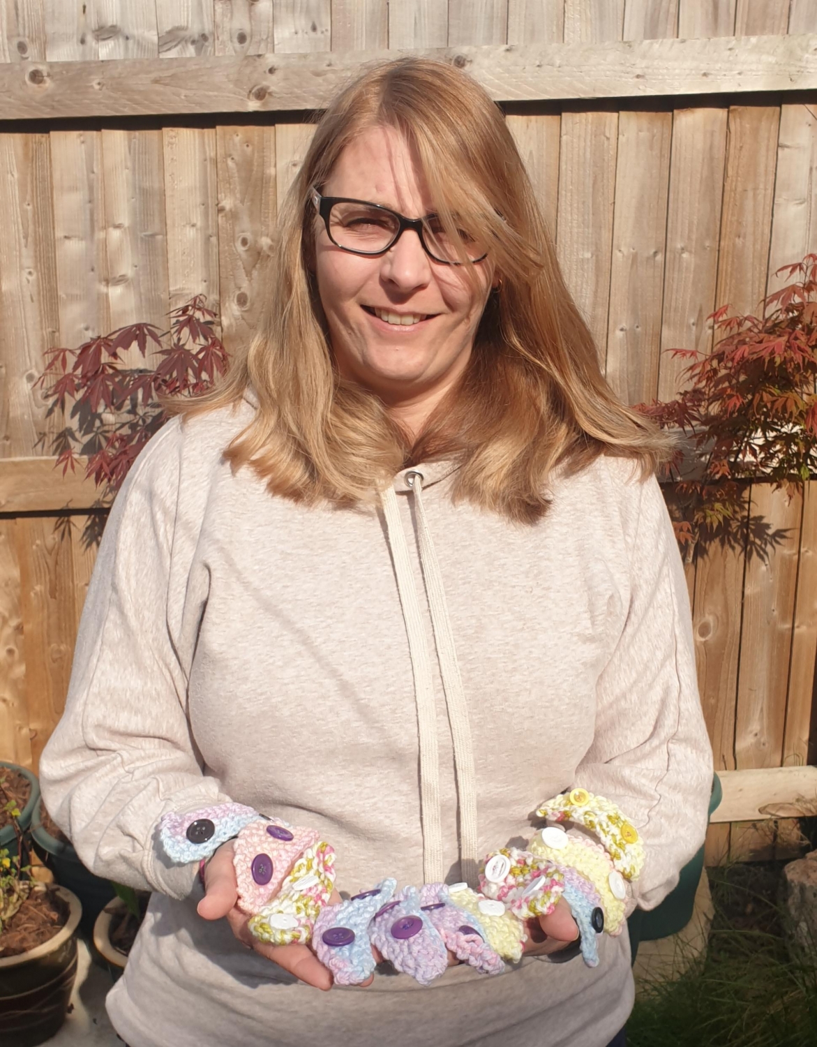 Emily Jewell with ear savers - Reaseheath College